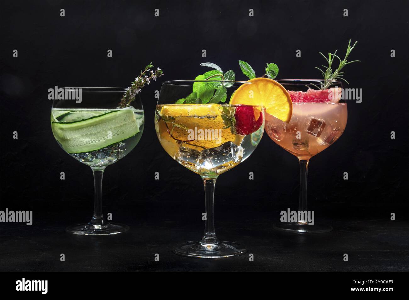 Fancy cocktails with fresh fruit. Gin and tonic drinks with ice at a ...