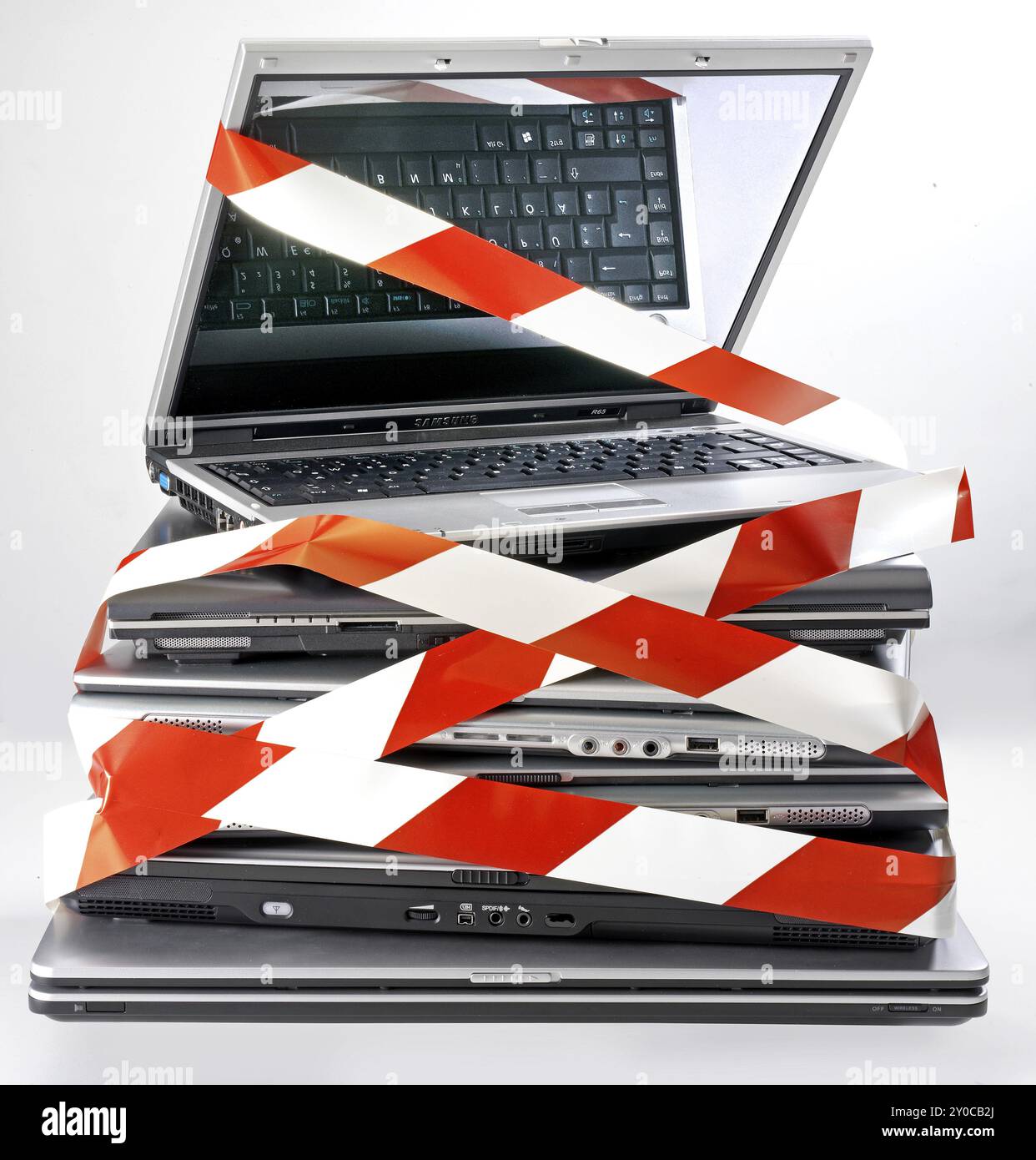 Pile of discarded notebooks, wrapped with barrier tape, disposal issue ...