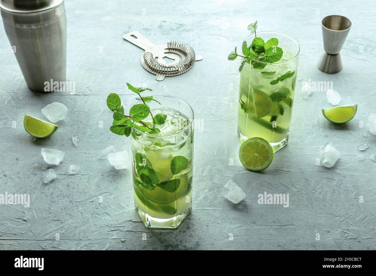 Mojito cocktail. Summer cold drink with lime, fresh mint, and ice. Cool ...
