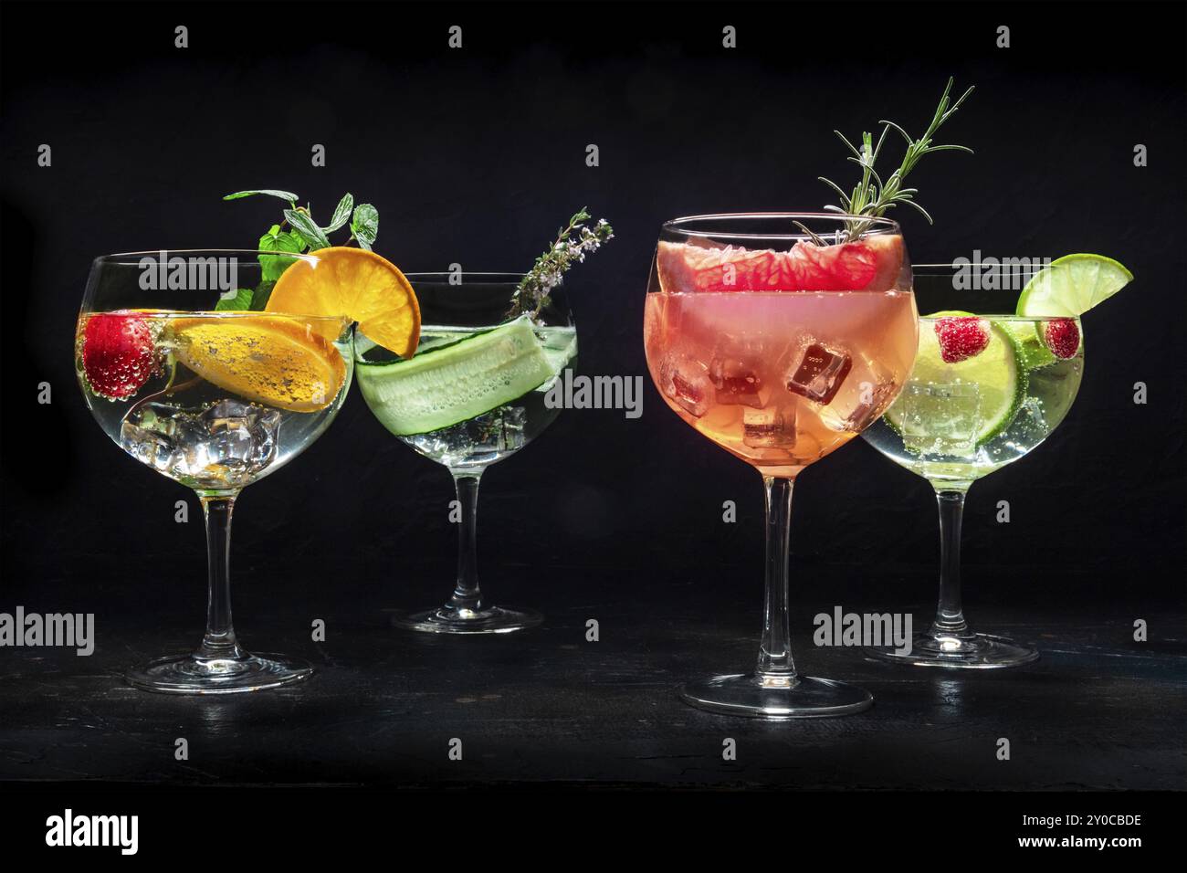 Fancy cocktails with fresh fruit. Many gin and tonic drinks with ice at ...
