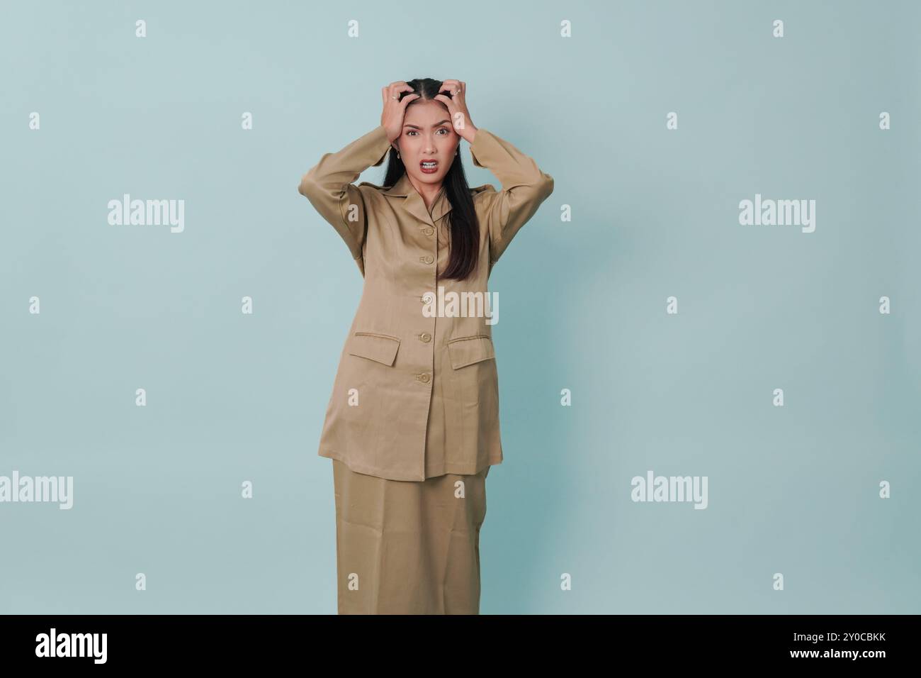 Frustrated Indonesian government worker woman wearing khaki uniform ...