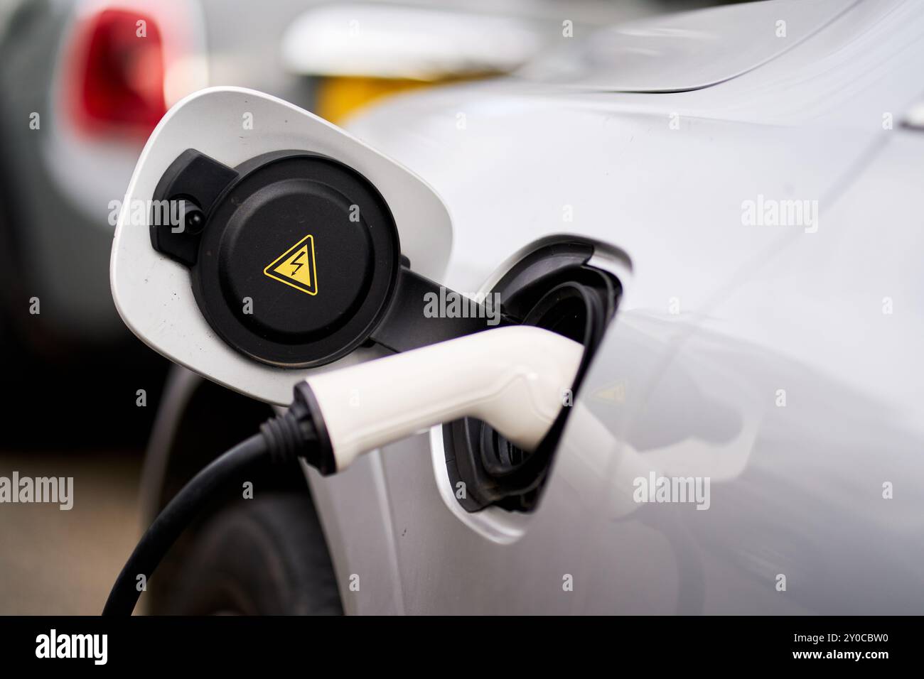 File photo dated 05/03/21 of an electric car plugged into an EV ...