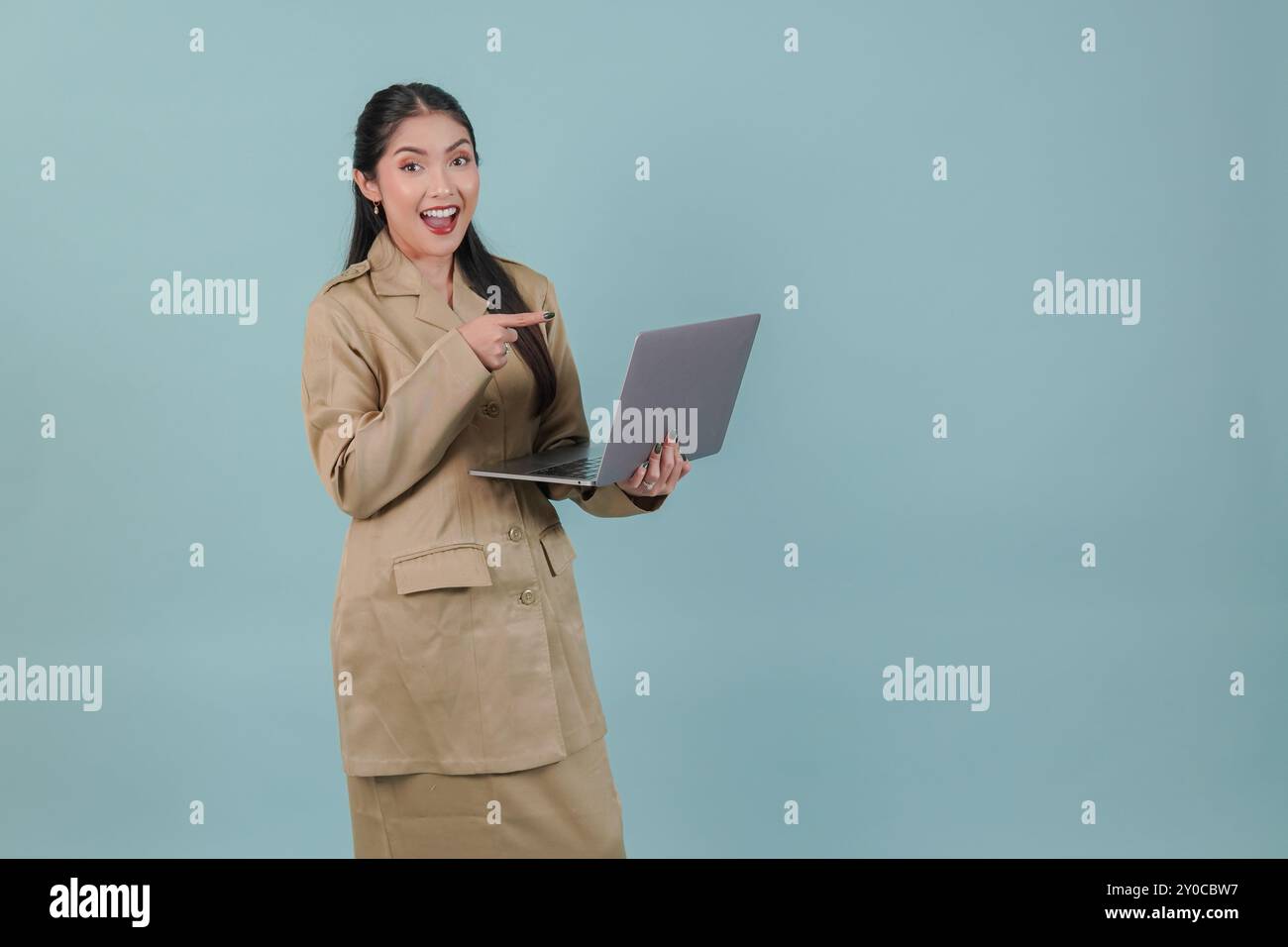 Cheerful Indonesian government worker woman wearing khaki uniform ...