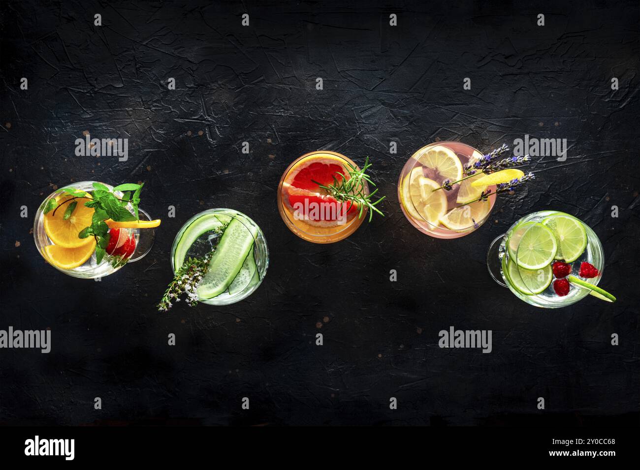 Fancy cocktails with fresh fruit. Gin and tonic drinks with ice at a ...