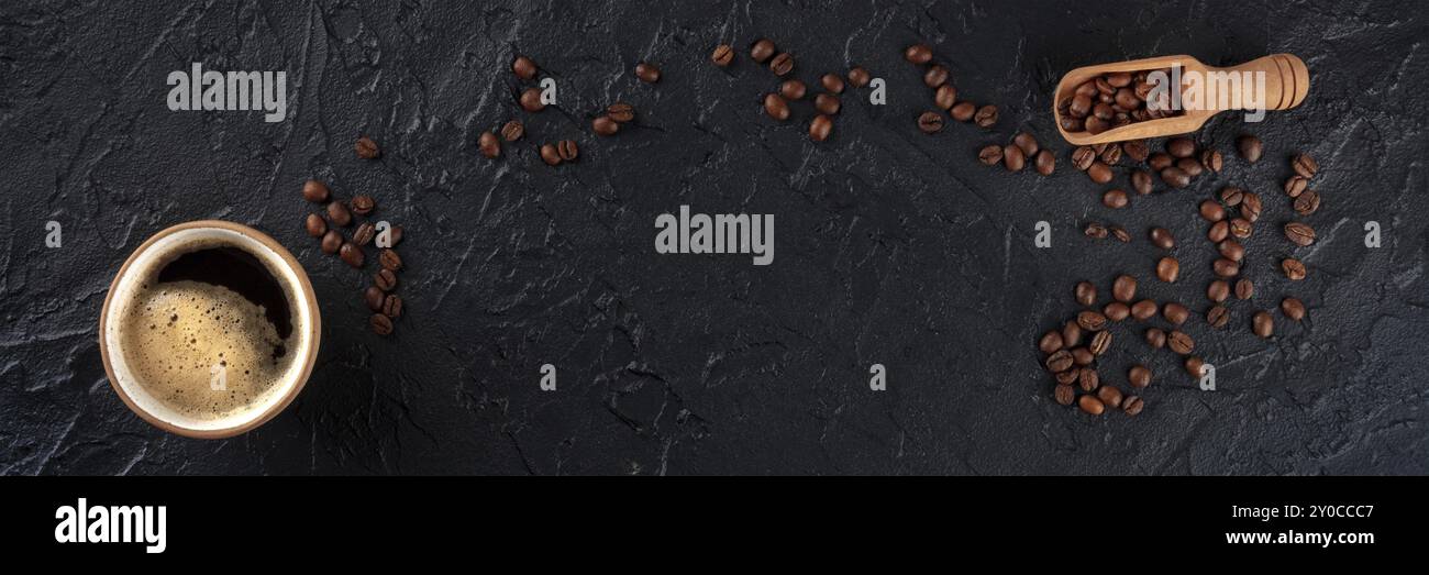 Coffee cup and beans panorama, overhead flat lay shot on a black ...