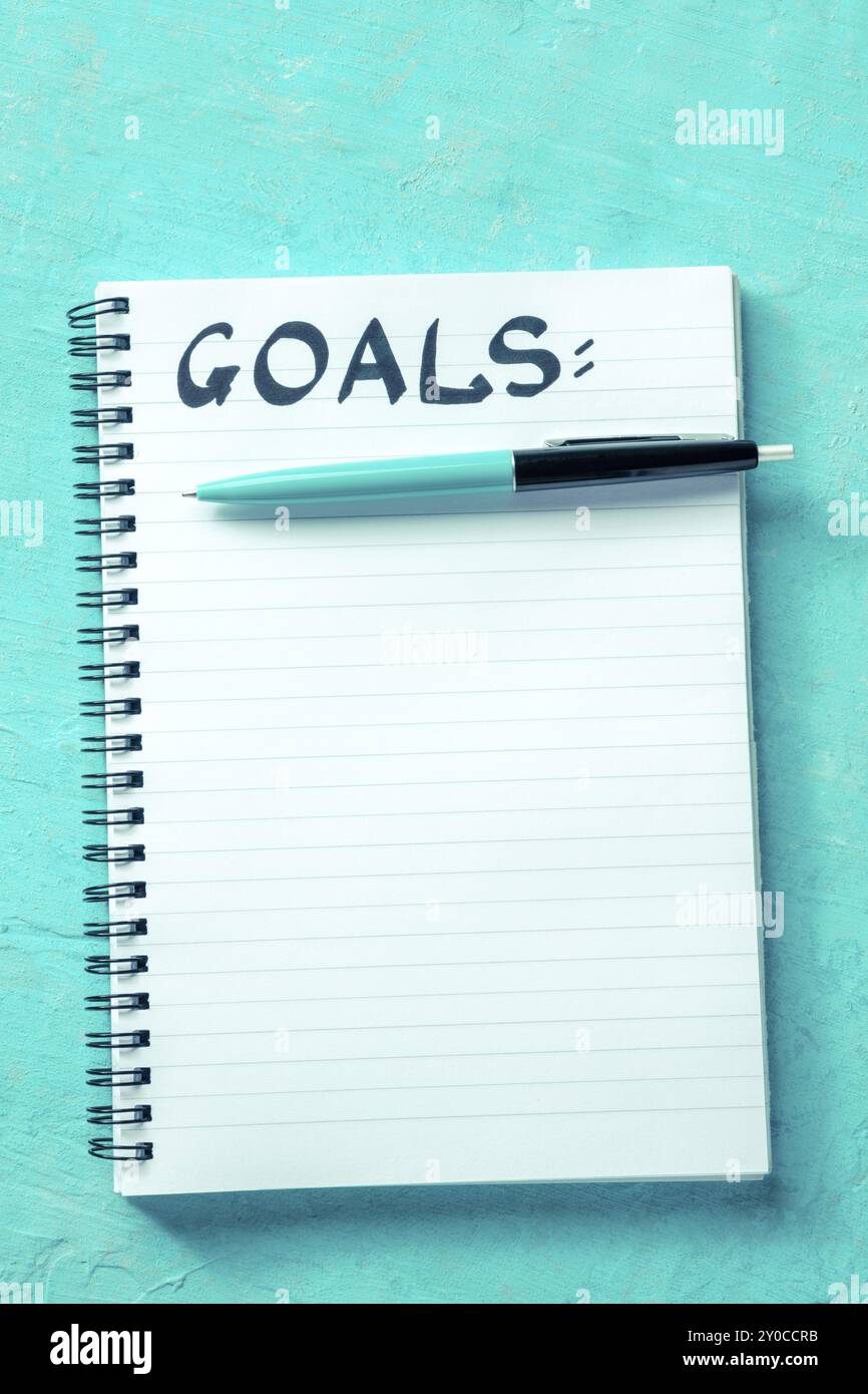 Goal Setting concept. Handwritten word Goals with a pen and a paper ...