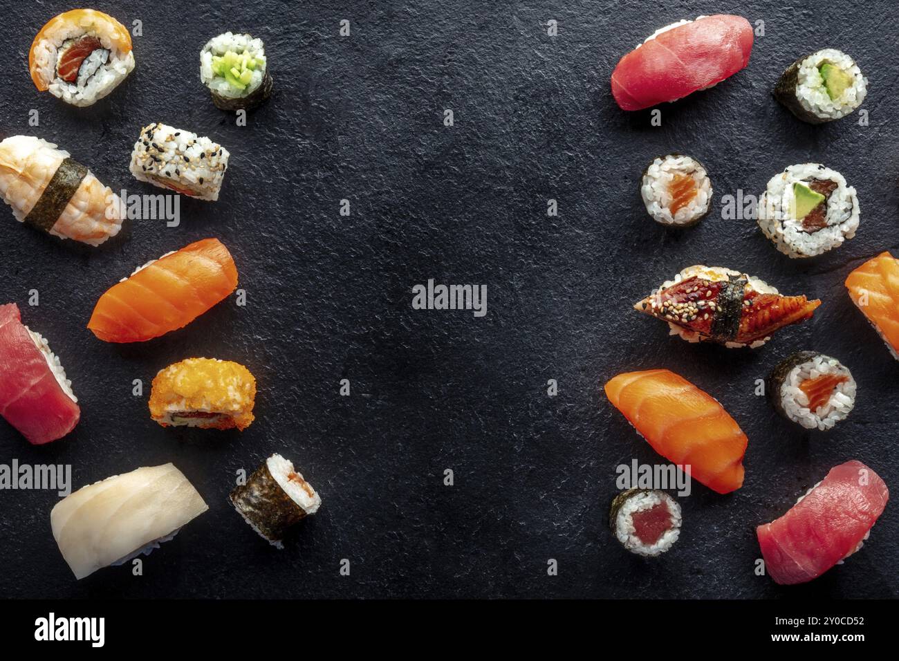 Sushi frame, overhead flat lay shot. Rolls, maki, nigiri on a black ...