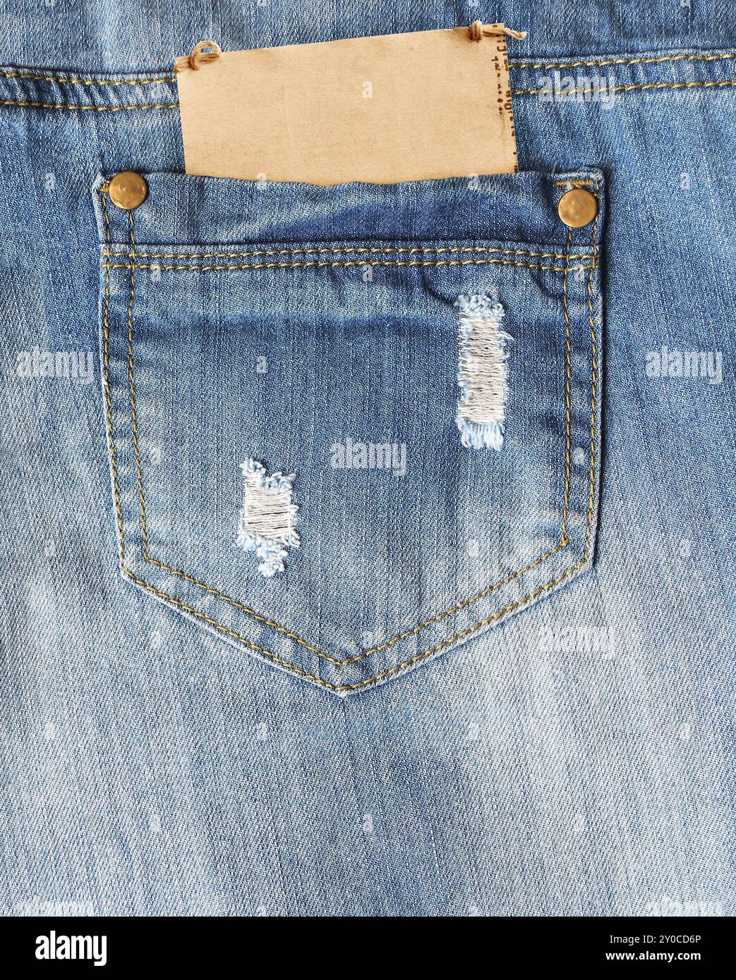 Blank organic paper price tag in jeans pocket. Background with denim ...