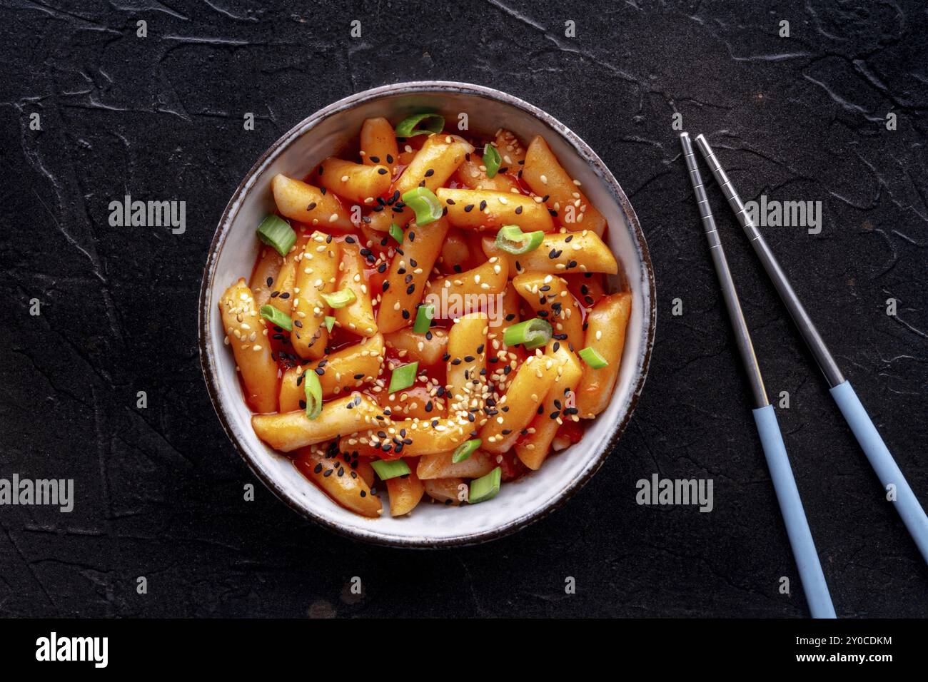 Tteokbokki or topokki, Korean street food, spicy rice cakes in red ...
