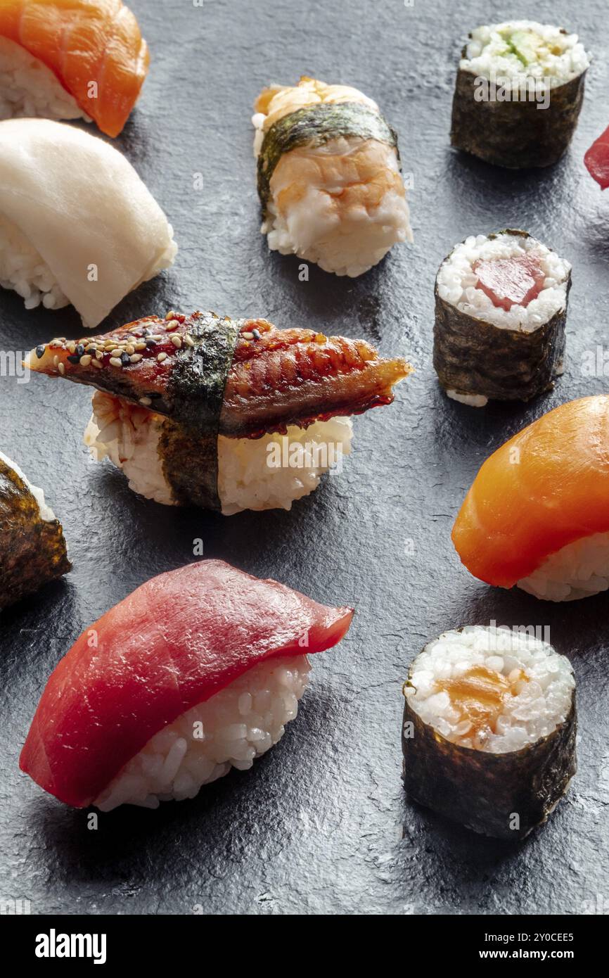 Sushi assortment. Maki and nigiri on a black background, Japanese food ...