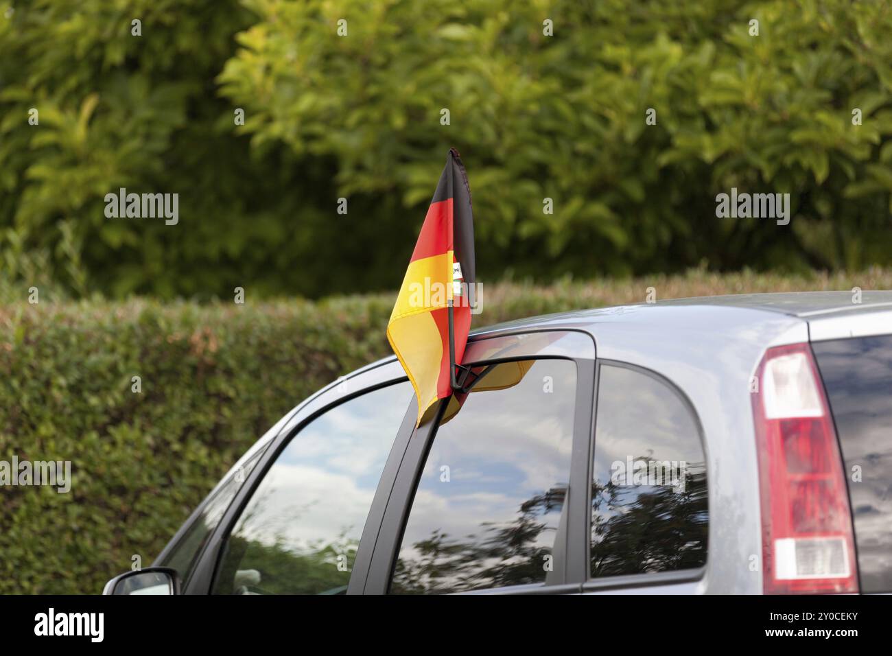 Showing the flag on a car Stock Photo - Alamy