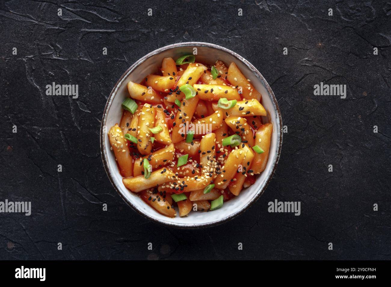 Tteokbokki or topokki, Korean street food, spicy rice cakes in red ...