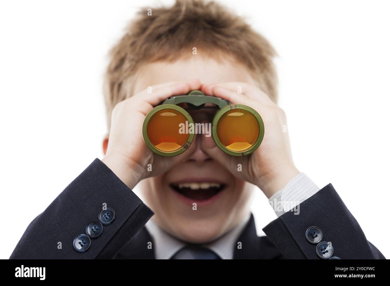 Little smiling child boy in business suit hand holding binoculars lens ...