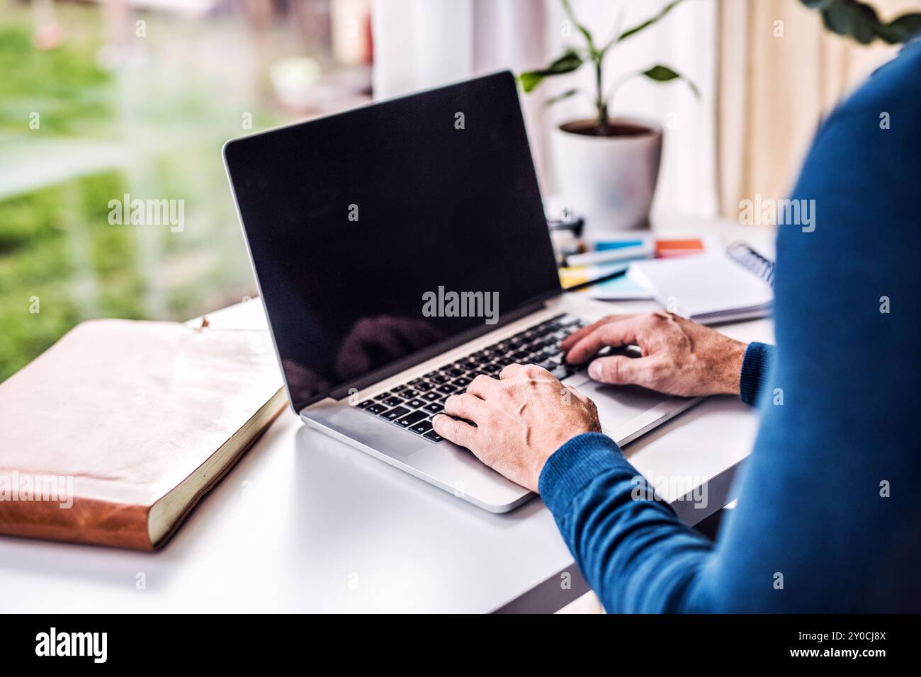 Homeoffice for handsome man. Man working on computer from home ...