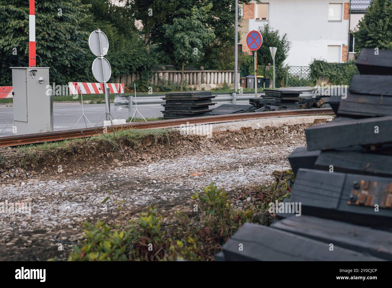 Renovating level grade crossing. Barriers over pedestrian train ...