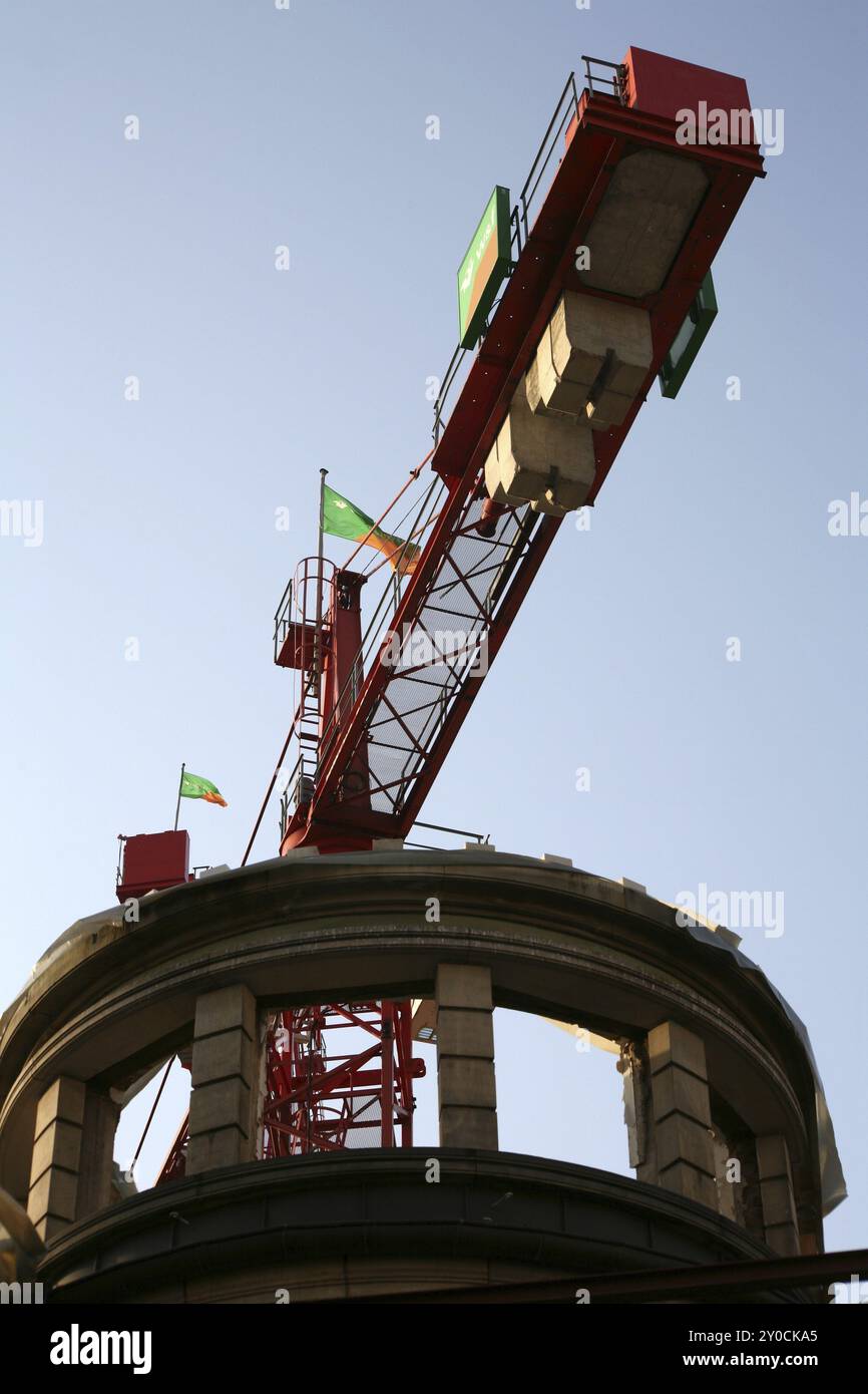 Construction cranes over residential buildings hi-res stock photography ...