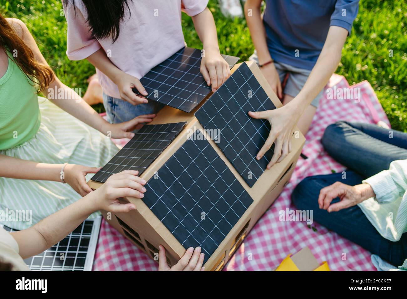 Children learning about renewable energy and solar panels during ...