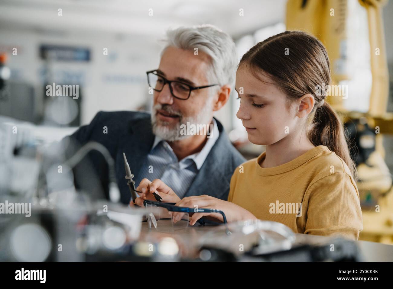 Father and girl during kid at work day, encouraging girl in career in ... Father and girl during kid at work day, encouraging girl in career in ...