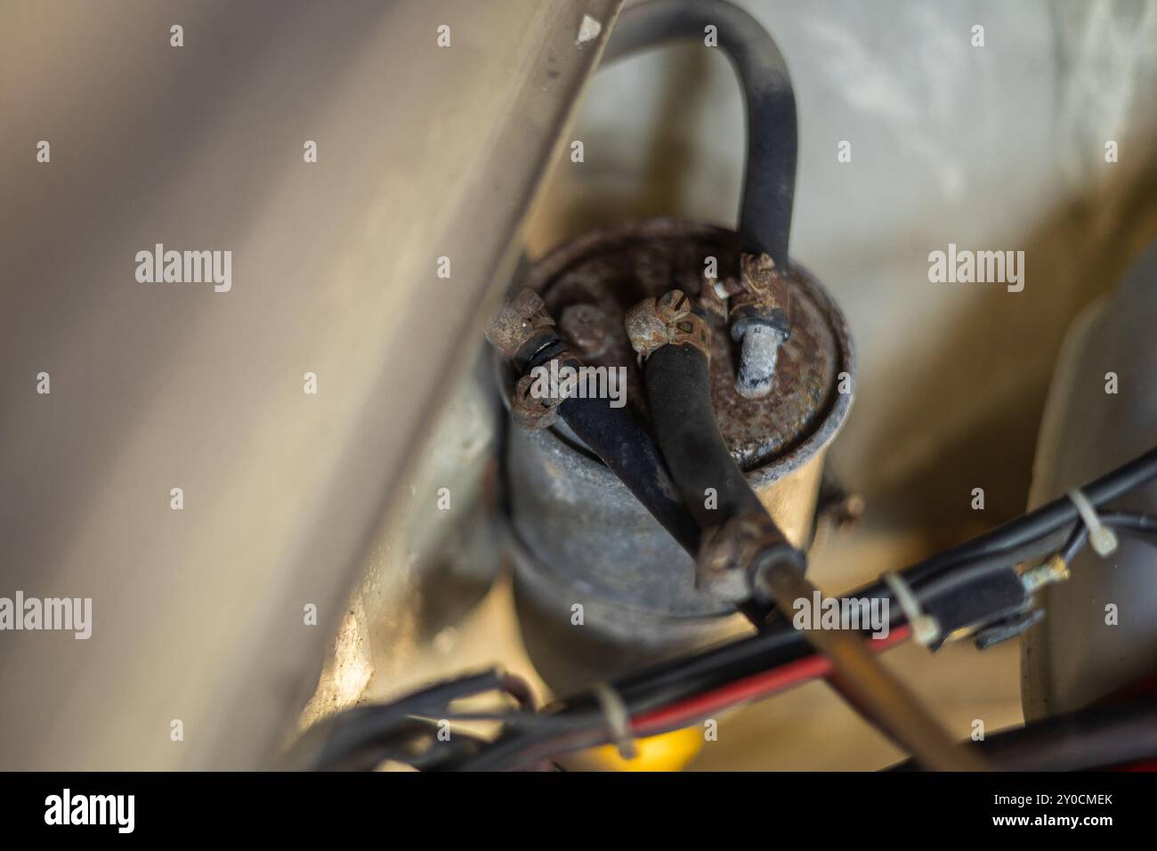 Old dirty and corroded connections of a diesel fuel filter on a van ...