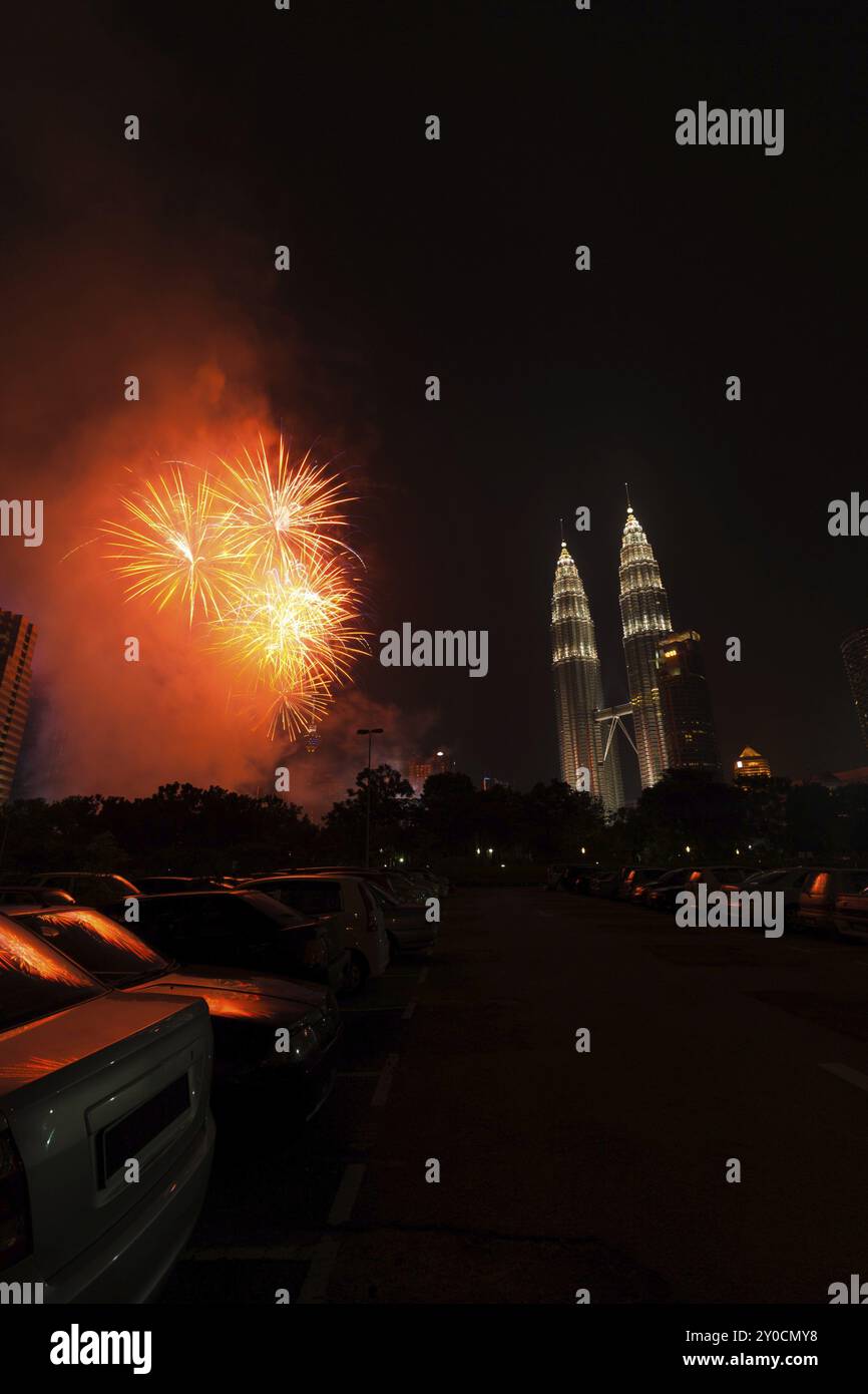 New year's eve fireworks light up the night sky near the Petronas ...