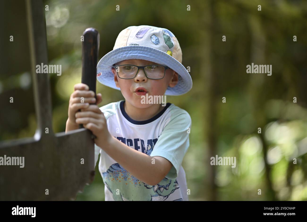 Child, boy aged 5, multi-ethnic, playing with marbles on XXL marble run ...