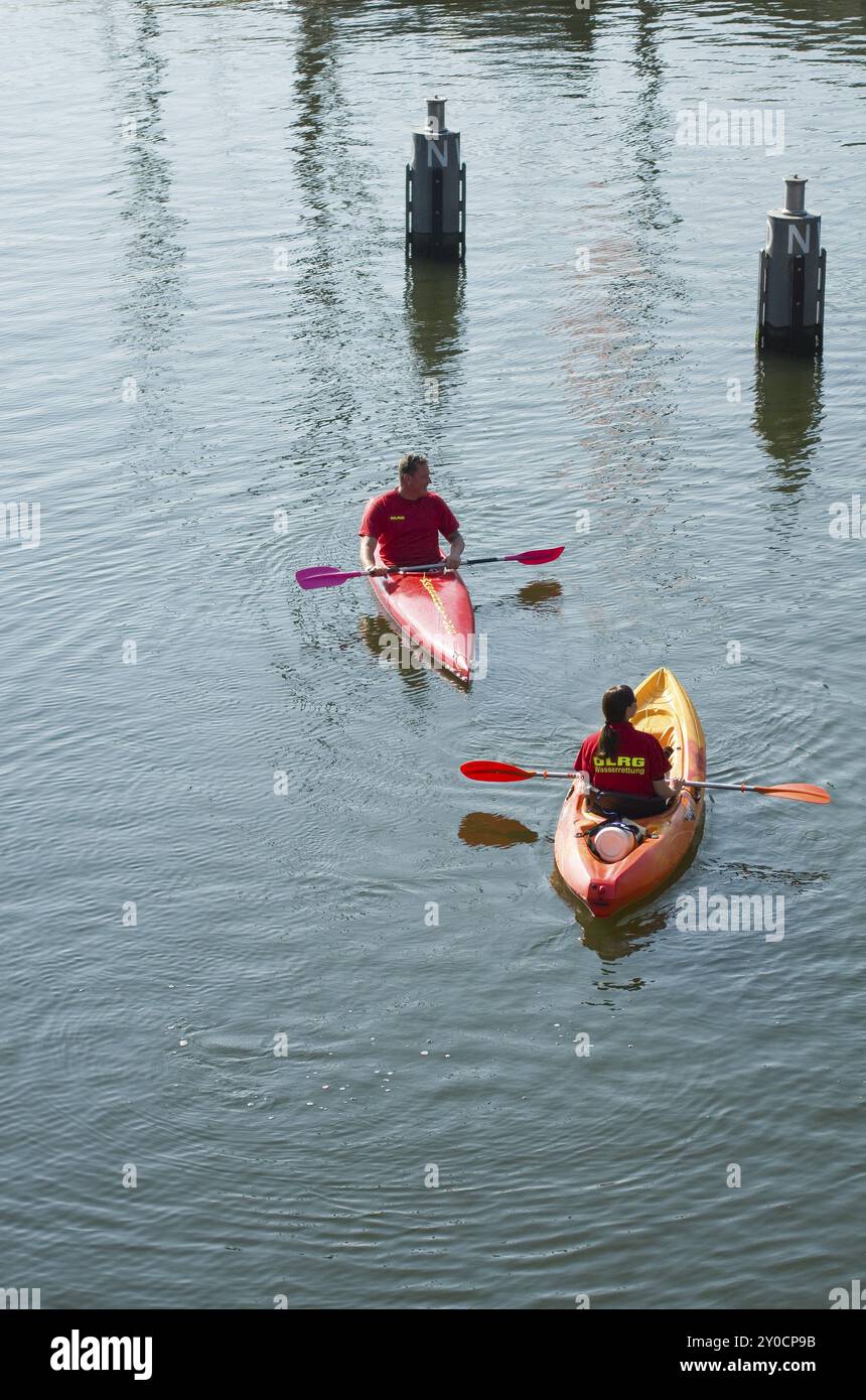 Kayak and lifeguard of the DLRG. Kayak and lifeguard Stock Photo - Alamy