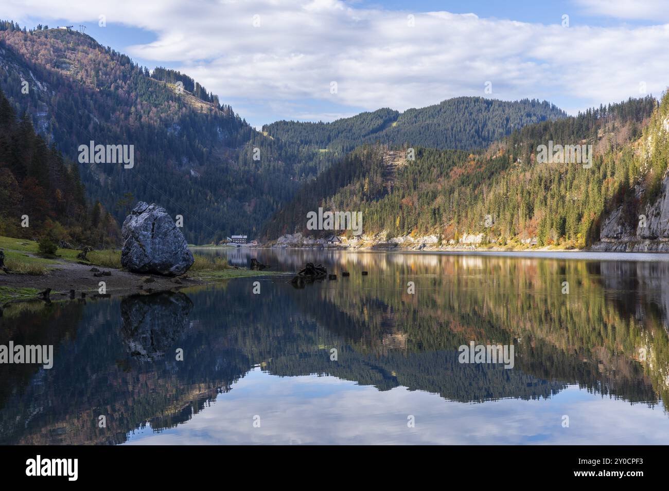 The Vordere Gosausee in autumn with a view of the Gasthof Gosausee. On ...