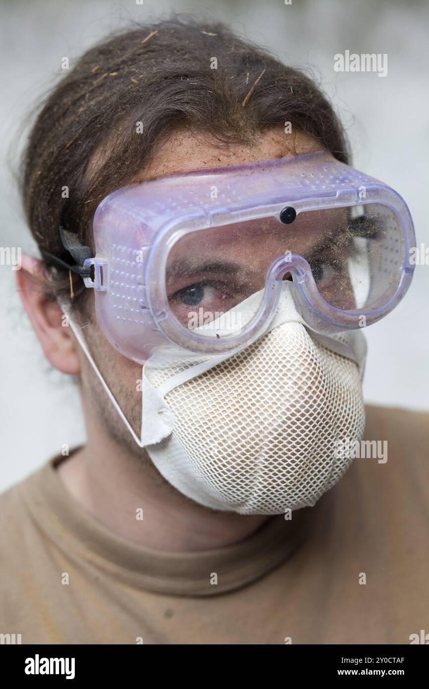 Workers with breathing masks and wood shavings in their hair Stock ...