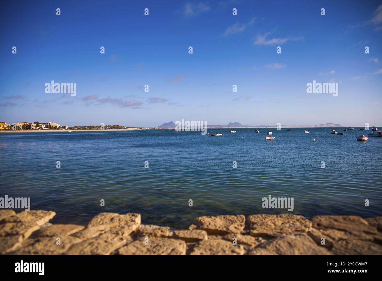 Small boats float in a bay Stock Photo - Alamy