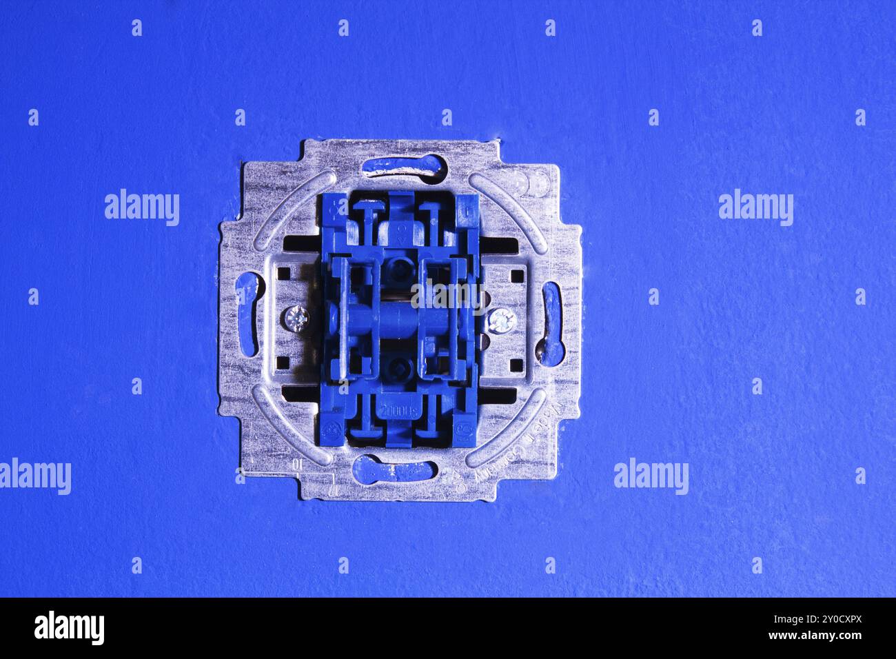 Light switch without cover on blue-painted wall Stock Photo - Alamy