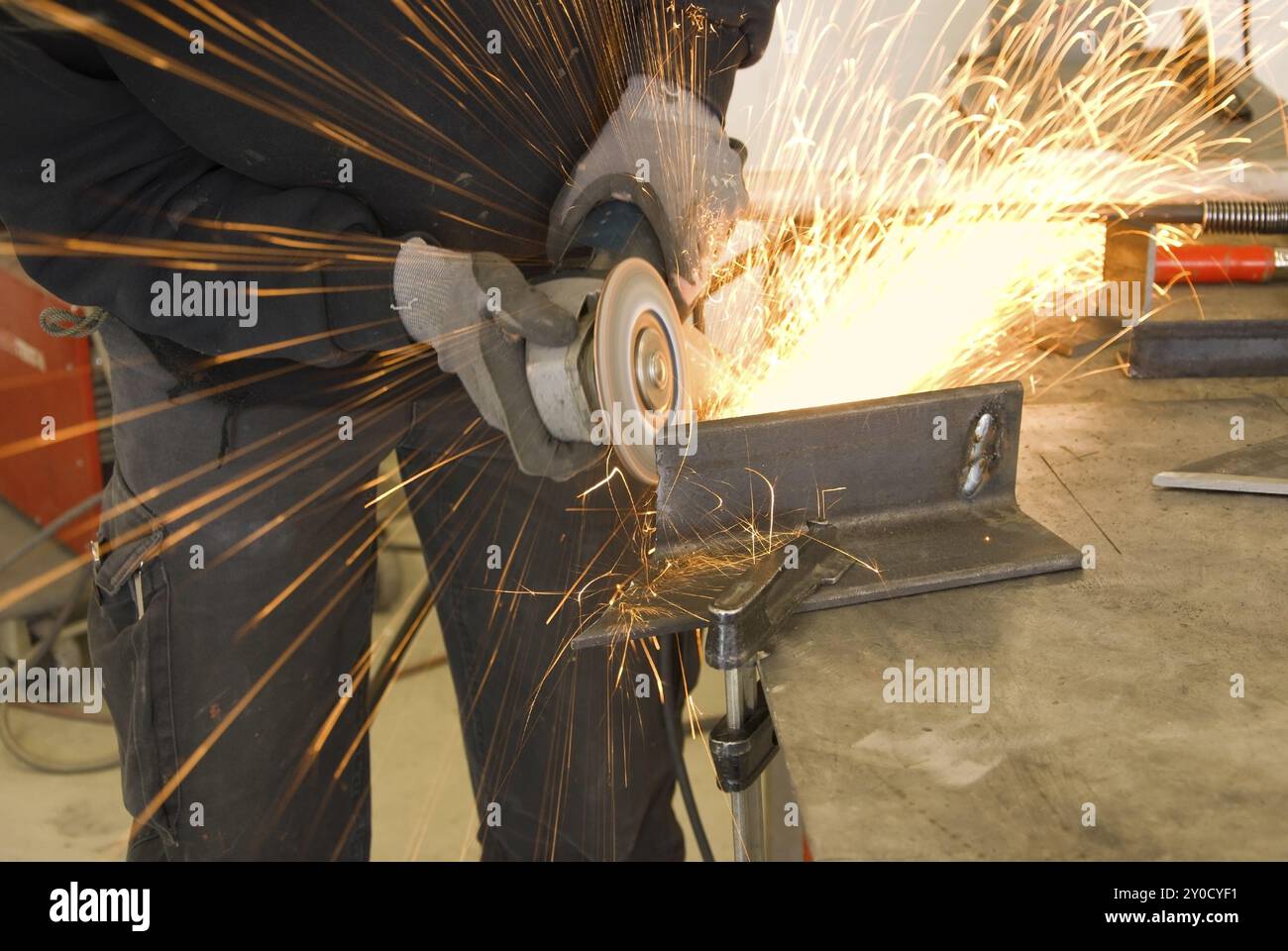 Metal worker with grinder and a lot of sparks Stock Photo - Alamy