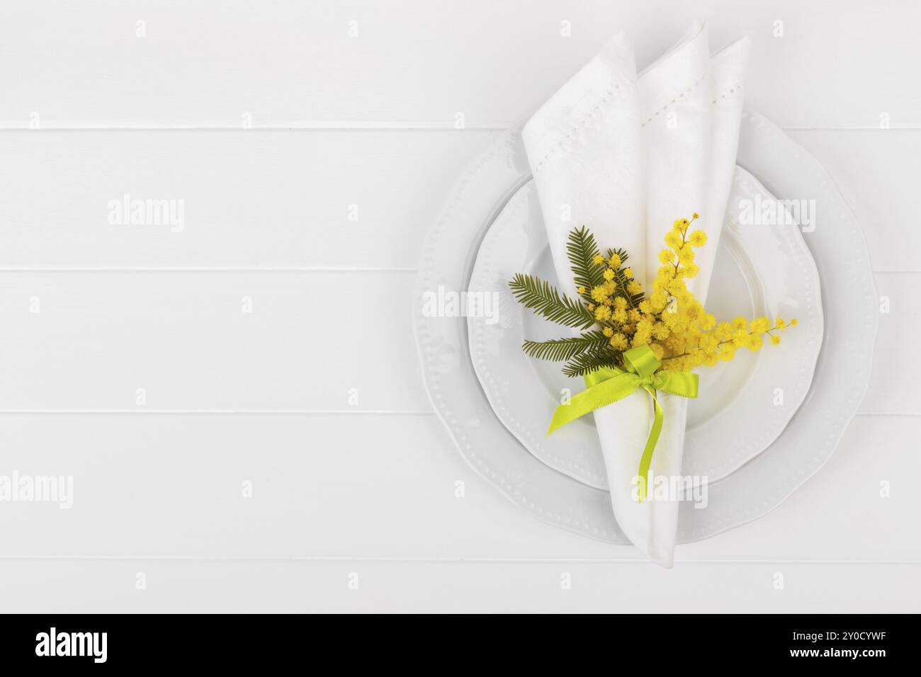 Spring table setting with mimosa. Holidays background with copyspace ...