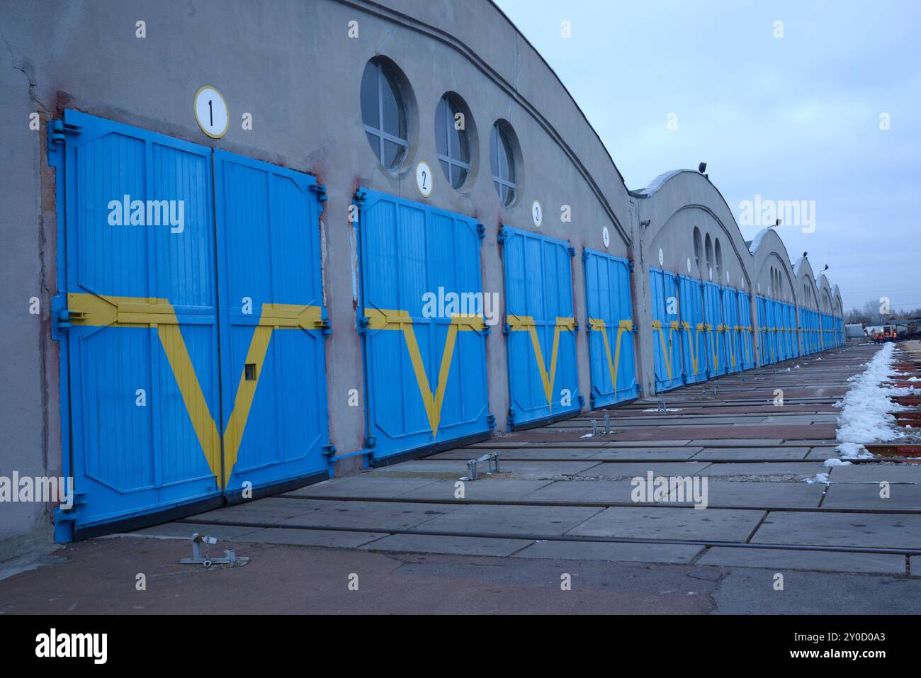 Subway car shed: empty tracks and wooden gates of the maintenance hall ...