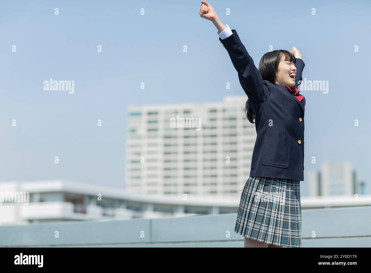 A smiling high school girl stretching Stock Photo - Alamy