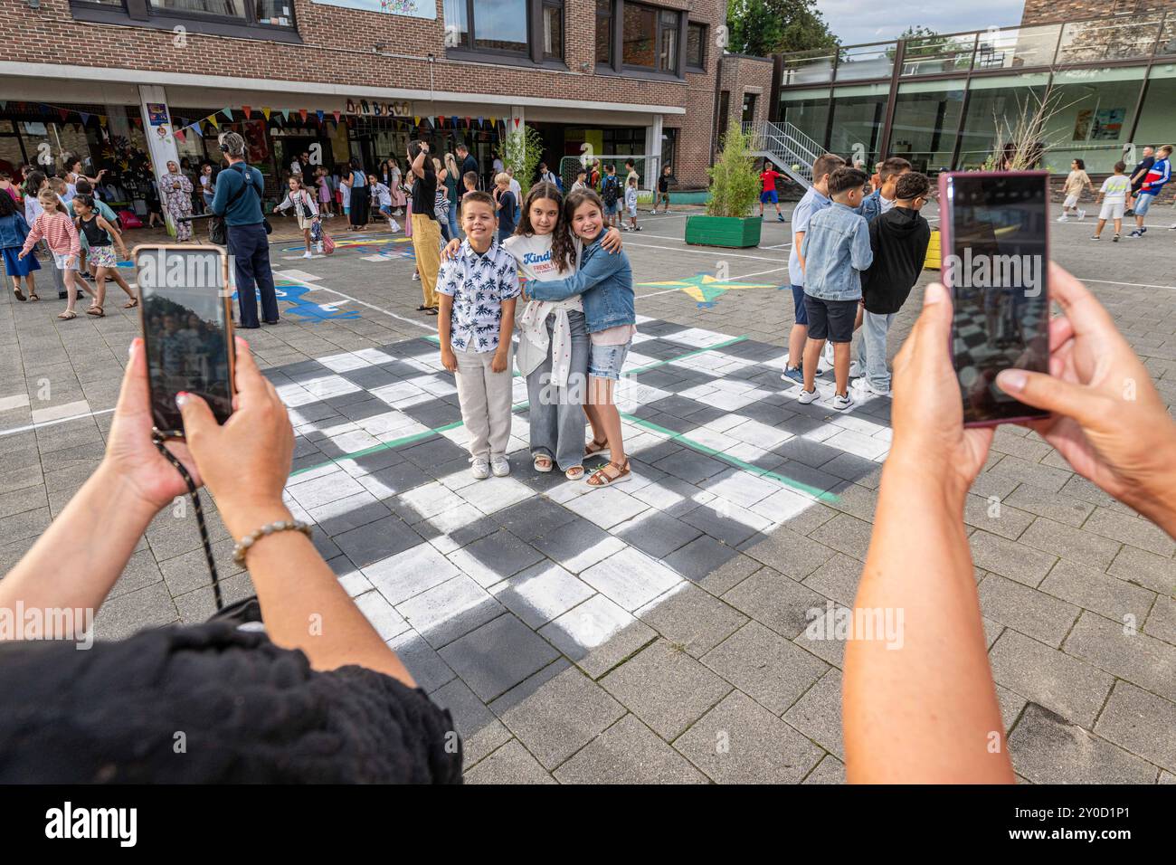 Sint Pieters Leeuw, Belgium. 02nd Sep, 2024. Parents photograph their ...
