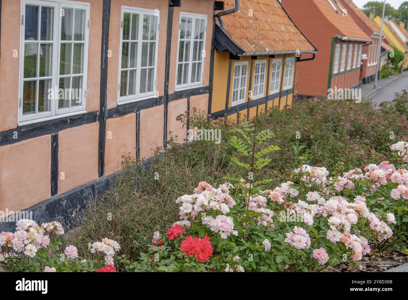 Traditional half-timbered houses with colourful roofs and windows ...