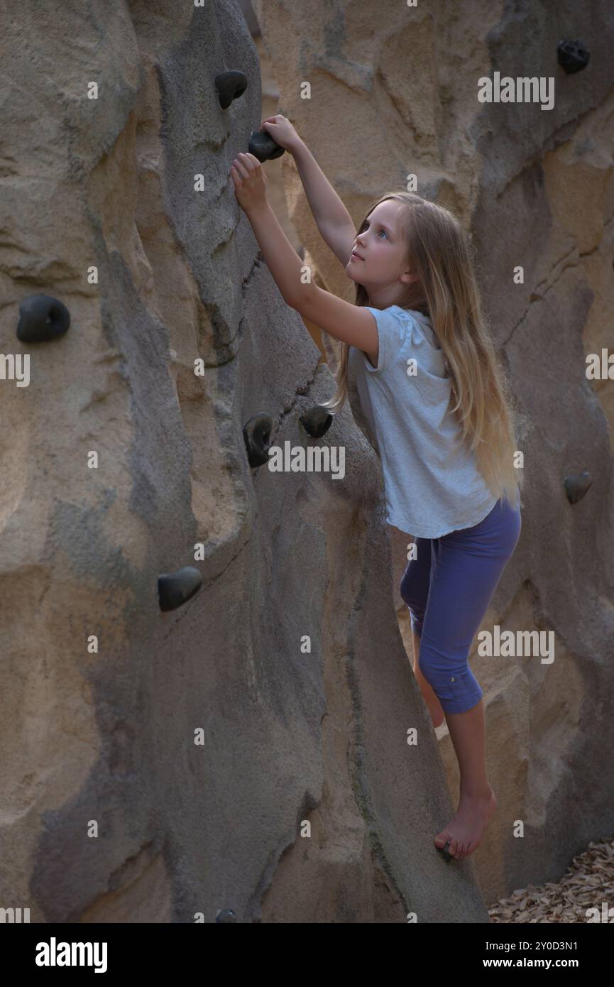 climbing girl in park Stock Photo - Alamy