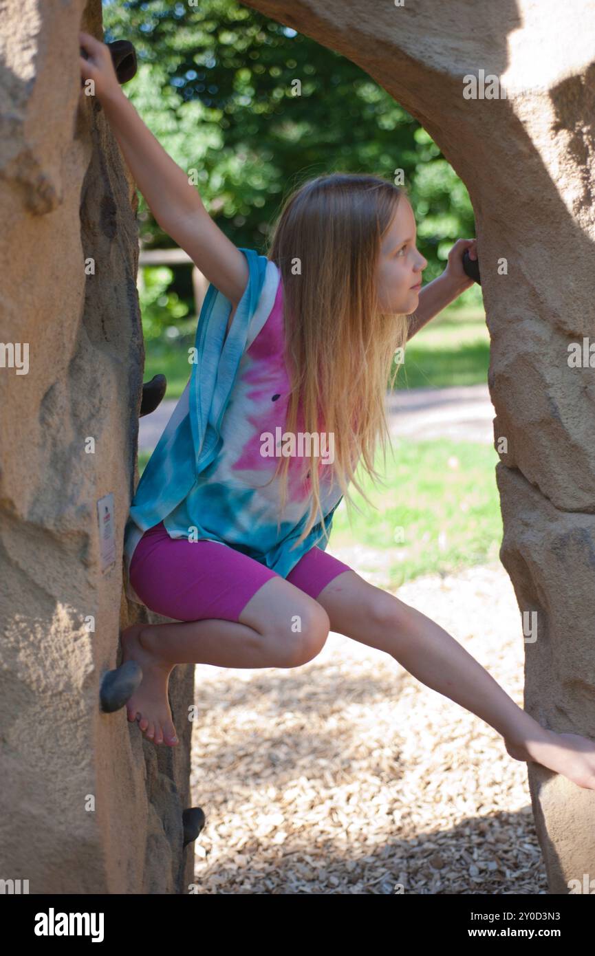 climbing girl in park Stock Photo - Alamy