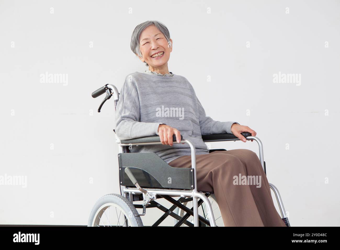 A senior woman on a wheelchair Stock Photo - Alamy