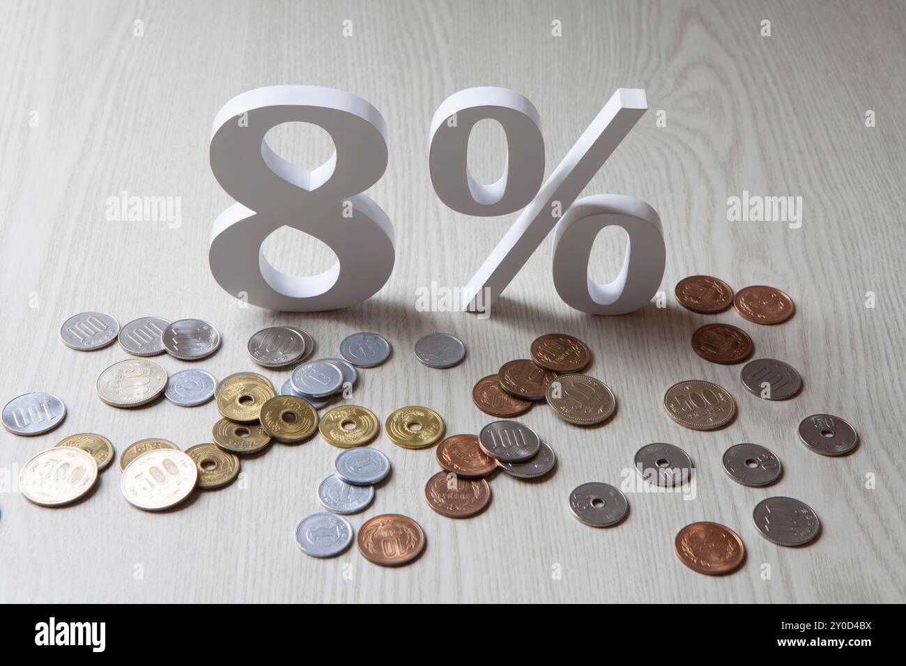 Consumption tax rate of 8% and coins Stock Photo - Alamy