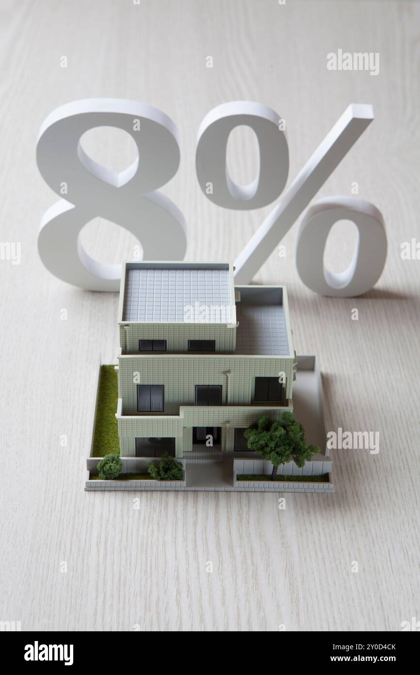 Consumption tax rate of 8% and models of house Stock Photo - Alamy