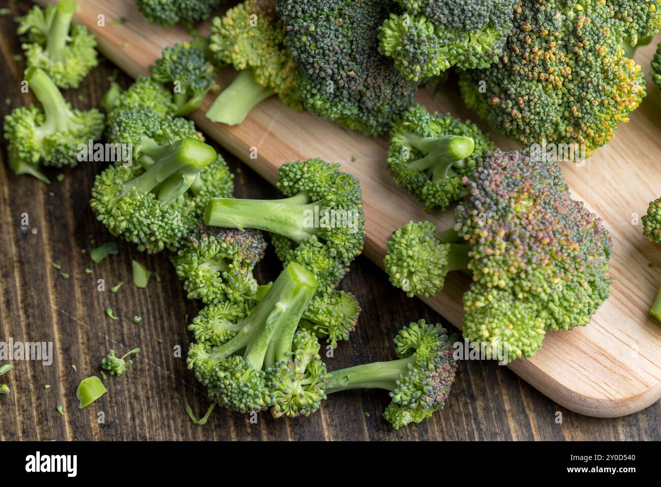 Green ripe broccoli in raw form, broccoli cabbage on the kitchen table ...