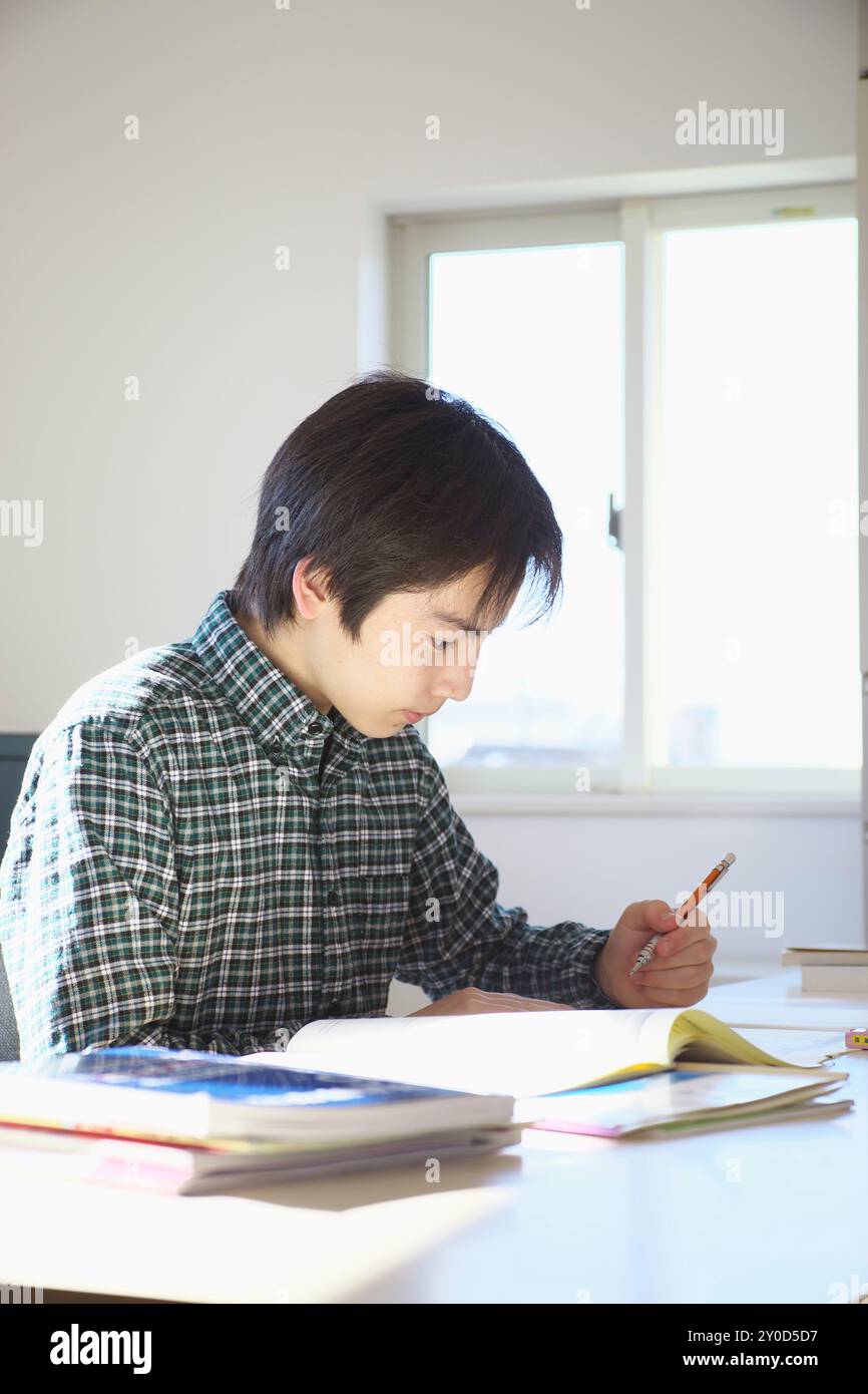 A boy studying Stock Photo - Alamy