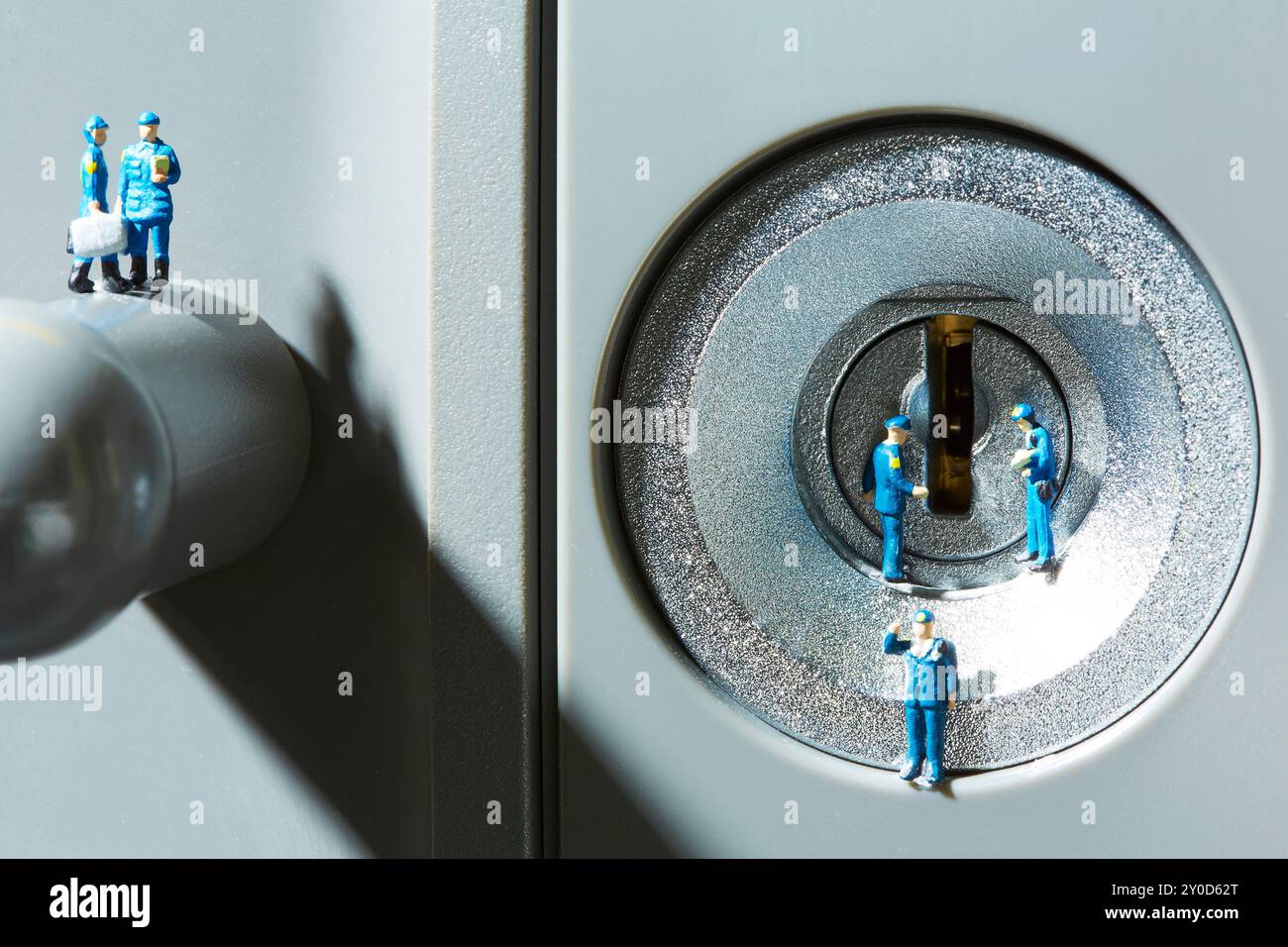 Five worker figures on safety box Stock Photo - Alamy