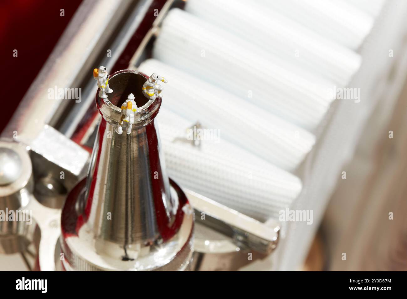 Four firefighter figures getting on fire hose Stock Photo - Alamy