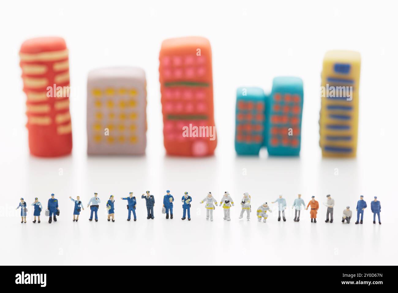 A clay building and a line of many dolls in front of it Stock Photo - Alamy