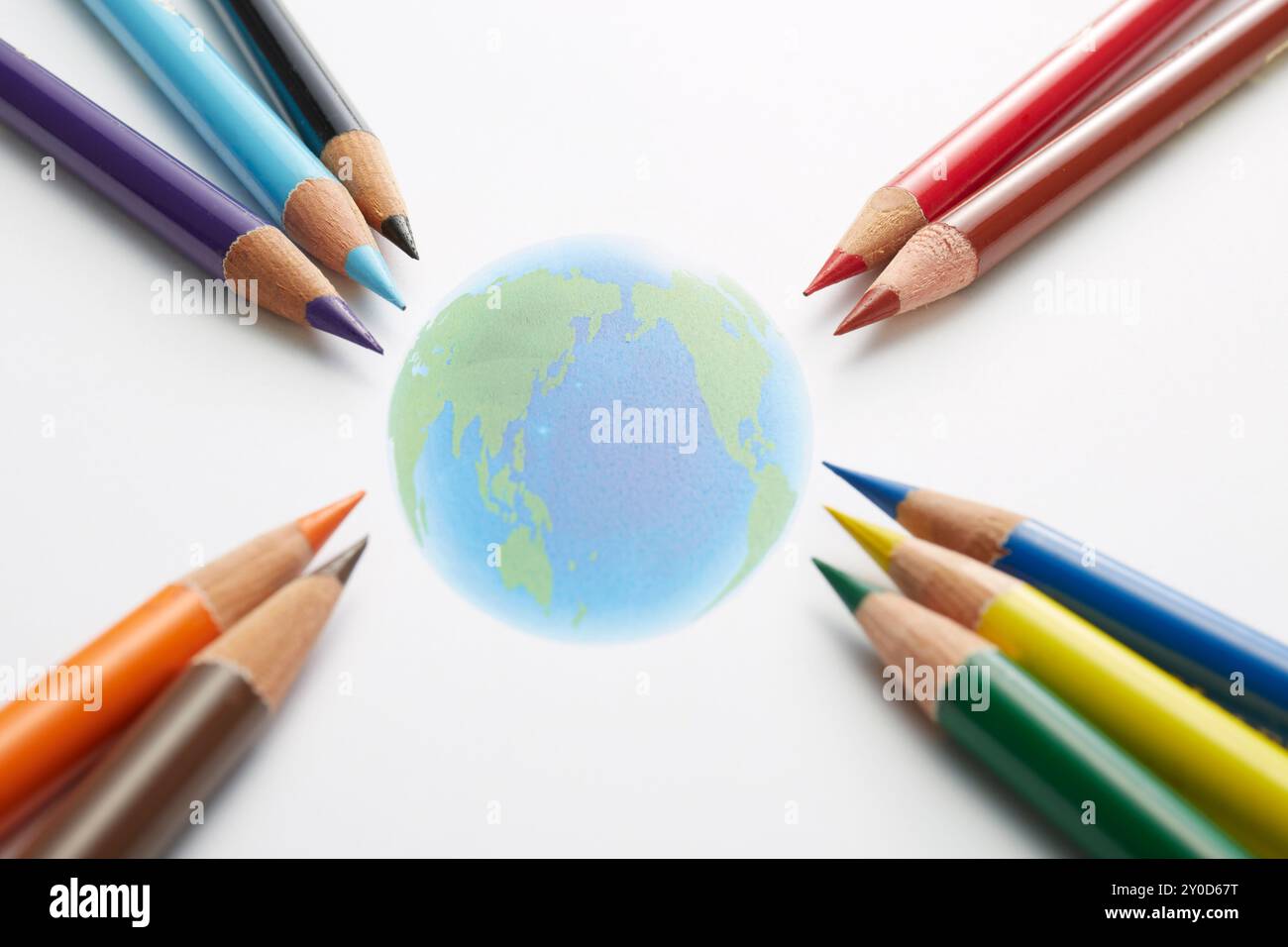 Colored pencils surrounding the Earth Stock Photo - Alamy