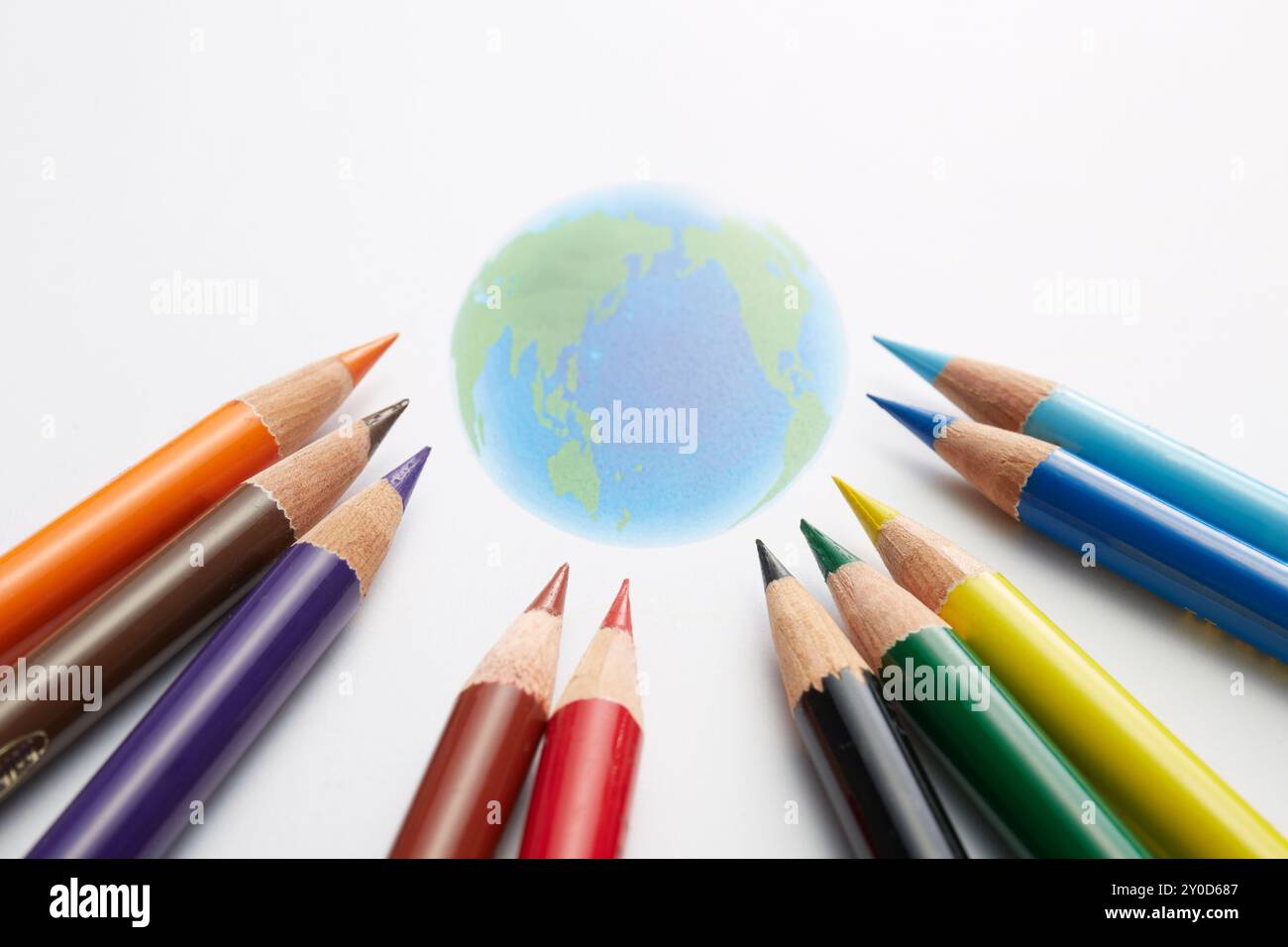 Colored pencils surrounding the Earth Stock Photo - Alamy