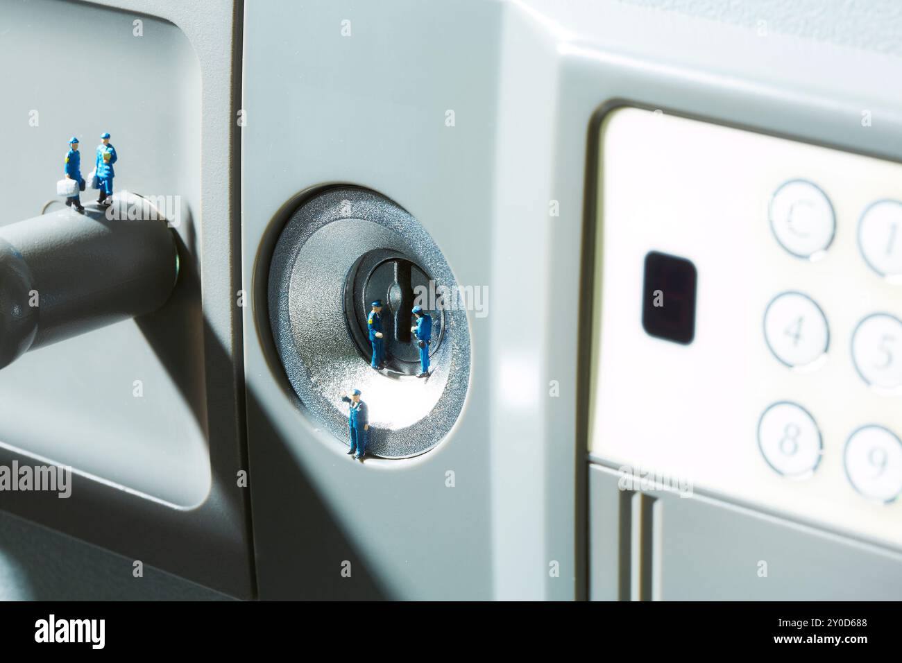 Five worker figures on safety box Stock Photo - Alamy