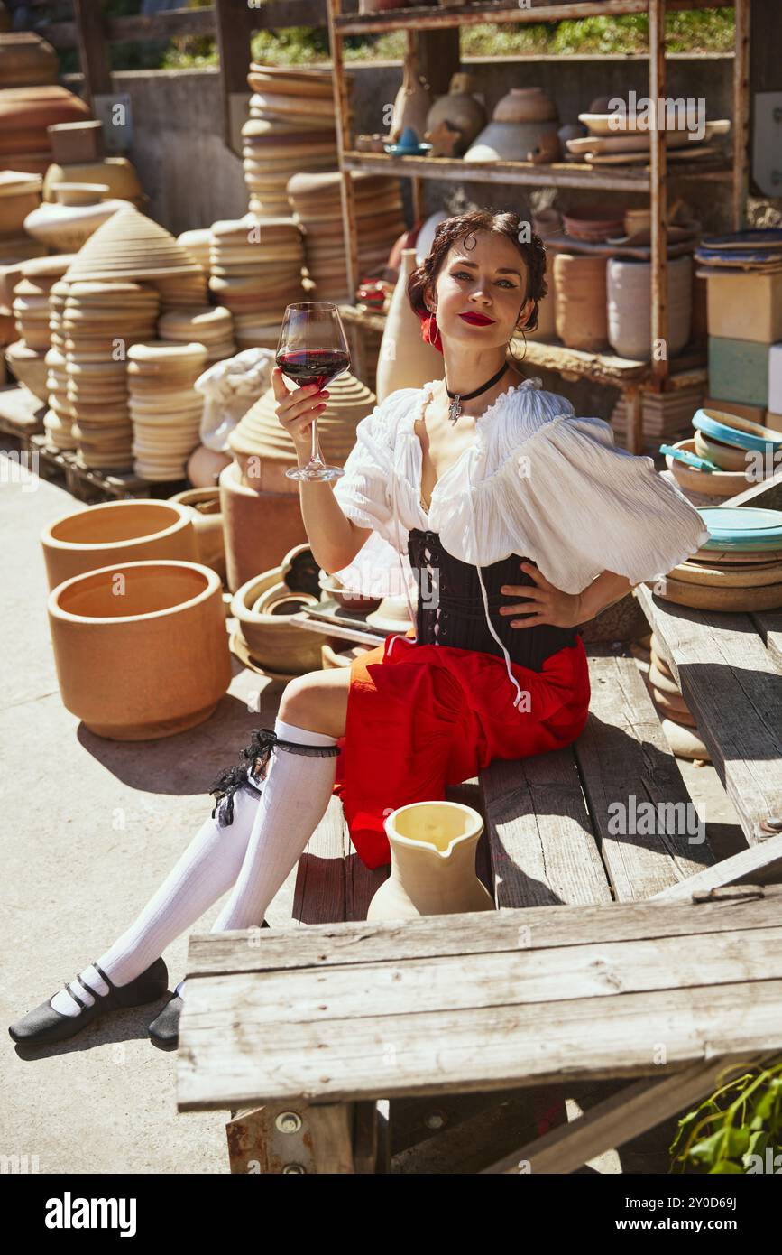 With playful expression, woman poses with her glass, capturing essence ...